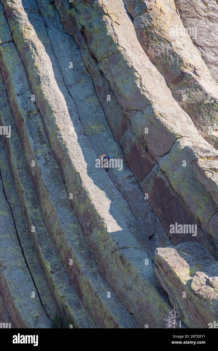 Rock climbers climbing up Devil's Tower Mountain in Devil's Tower ...