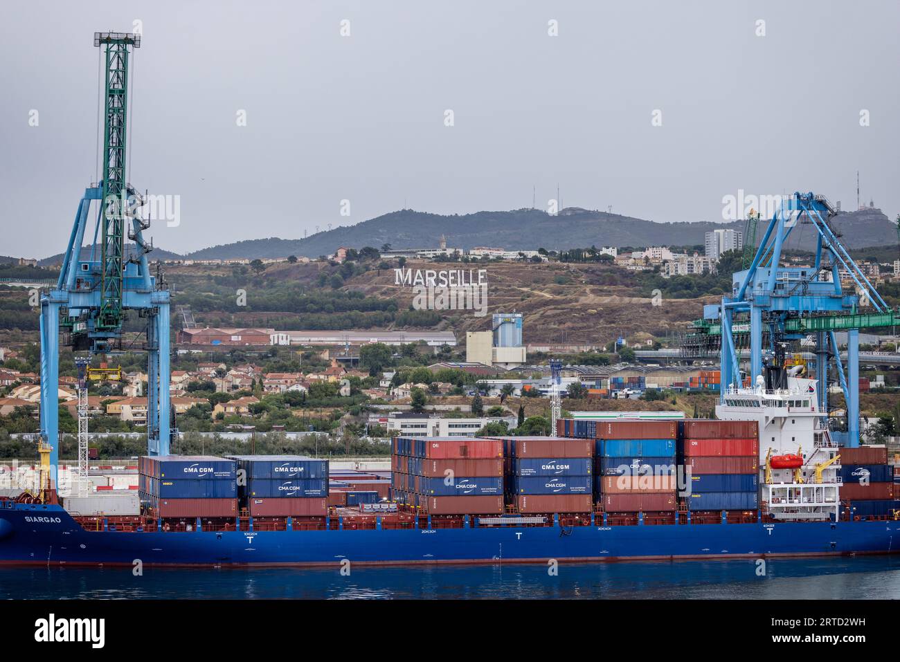 Container ship being loaded at Marseille container port with Marseille ...