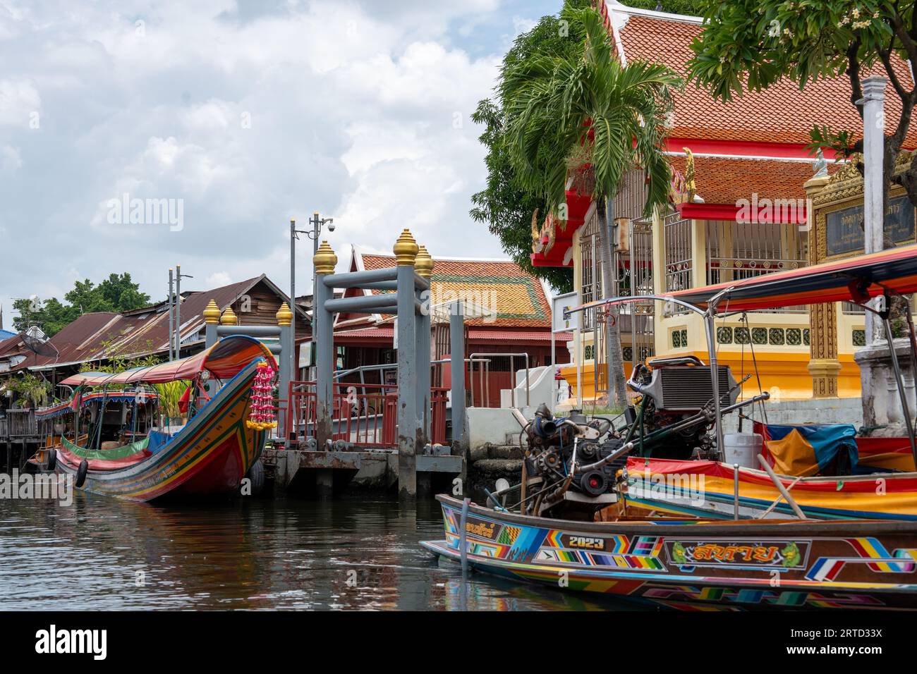 A klong or river channel of Chao Phraya river with longtail wooden ...