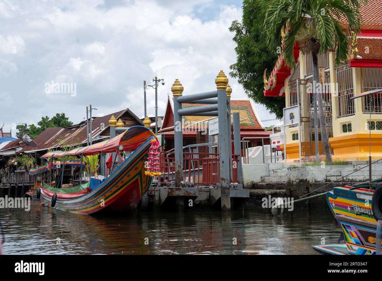 A klong or river channel of Chao Phraya river with longtail wooden ...