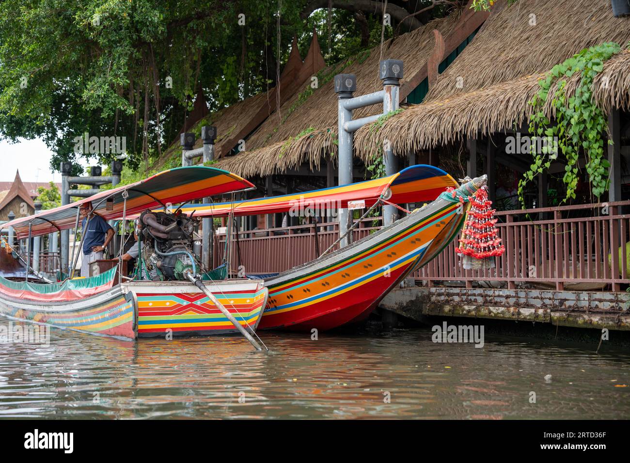 A klong or river channel of Chao Phraya river with longtail wooden ...