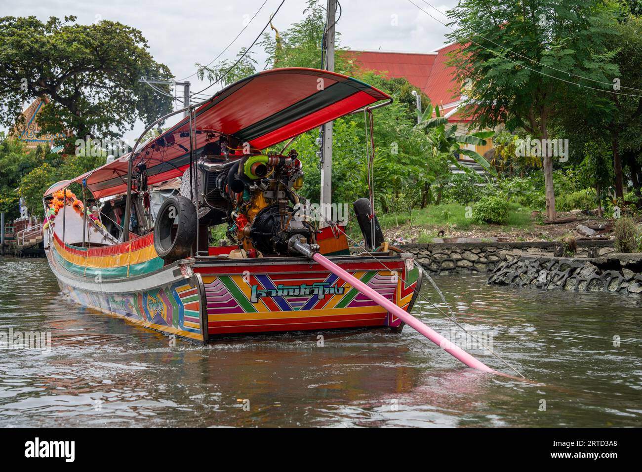 A klong or river channel of Chao Phraya river with longtail wooden ...