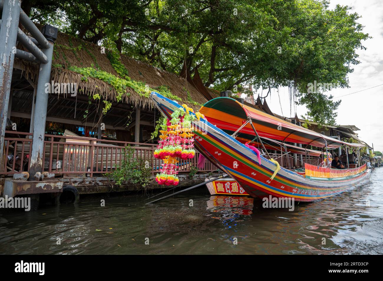 A klong or river channel of Chao Phraya river with longtail wooden ...