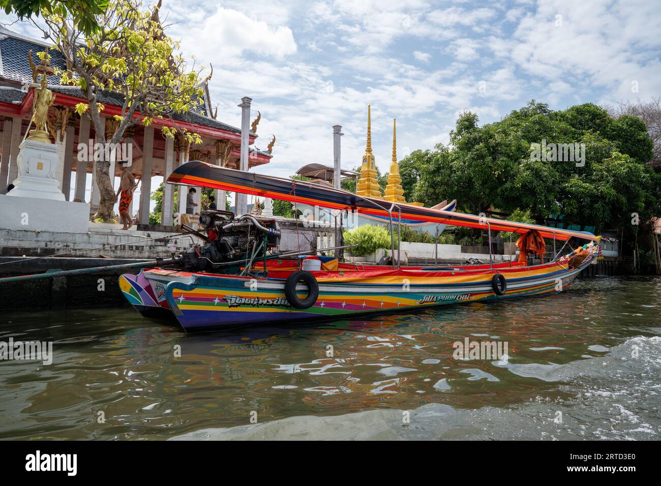 A klong or river channel of Chao Phraya river with longtail wooden ...