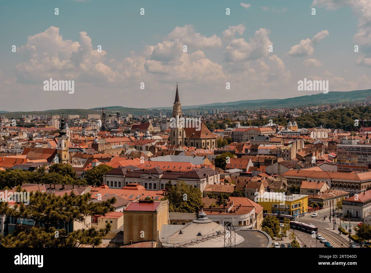 A stunning aerial view of a sprawling urban area surrounded by lush ...