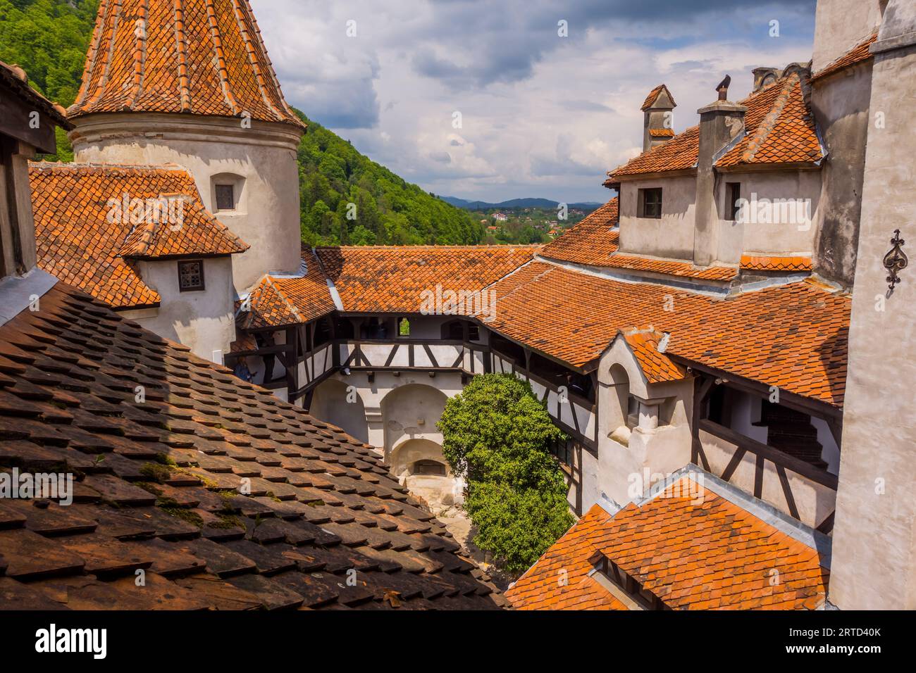A picturesque architectural scene with a red-tiled roofed building ...