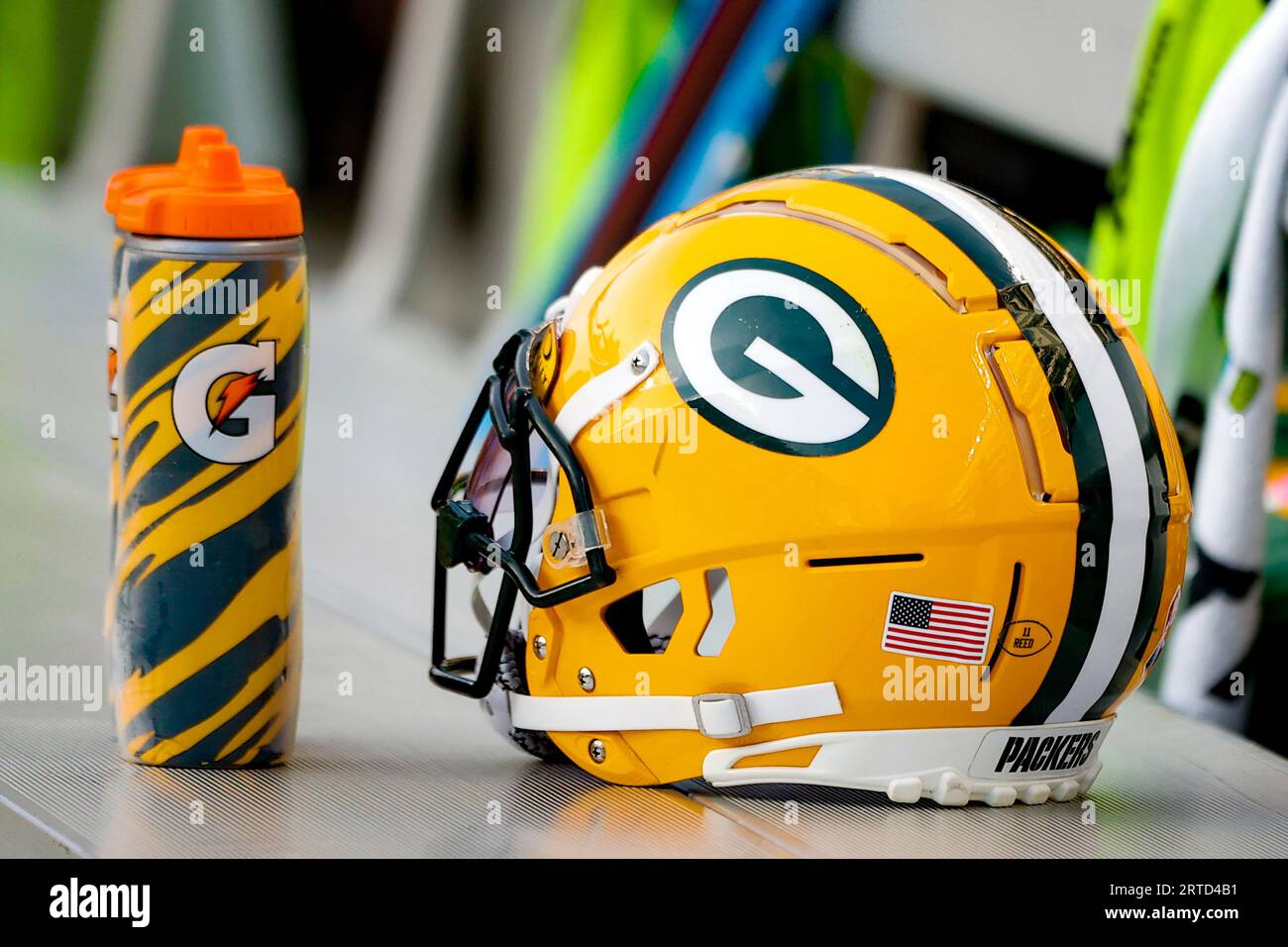 Green Bay Packers helmet sits on the bench next to Gatorade bottle ...