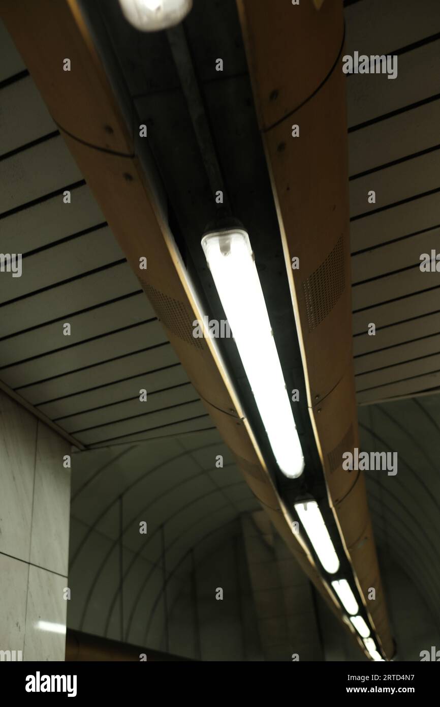 Lights dimmed in the underground metro station to regulate traffic flow ...