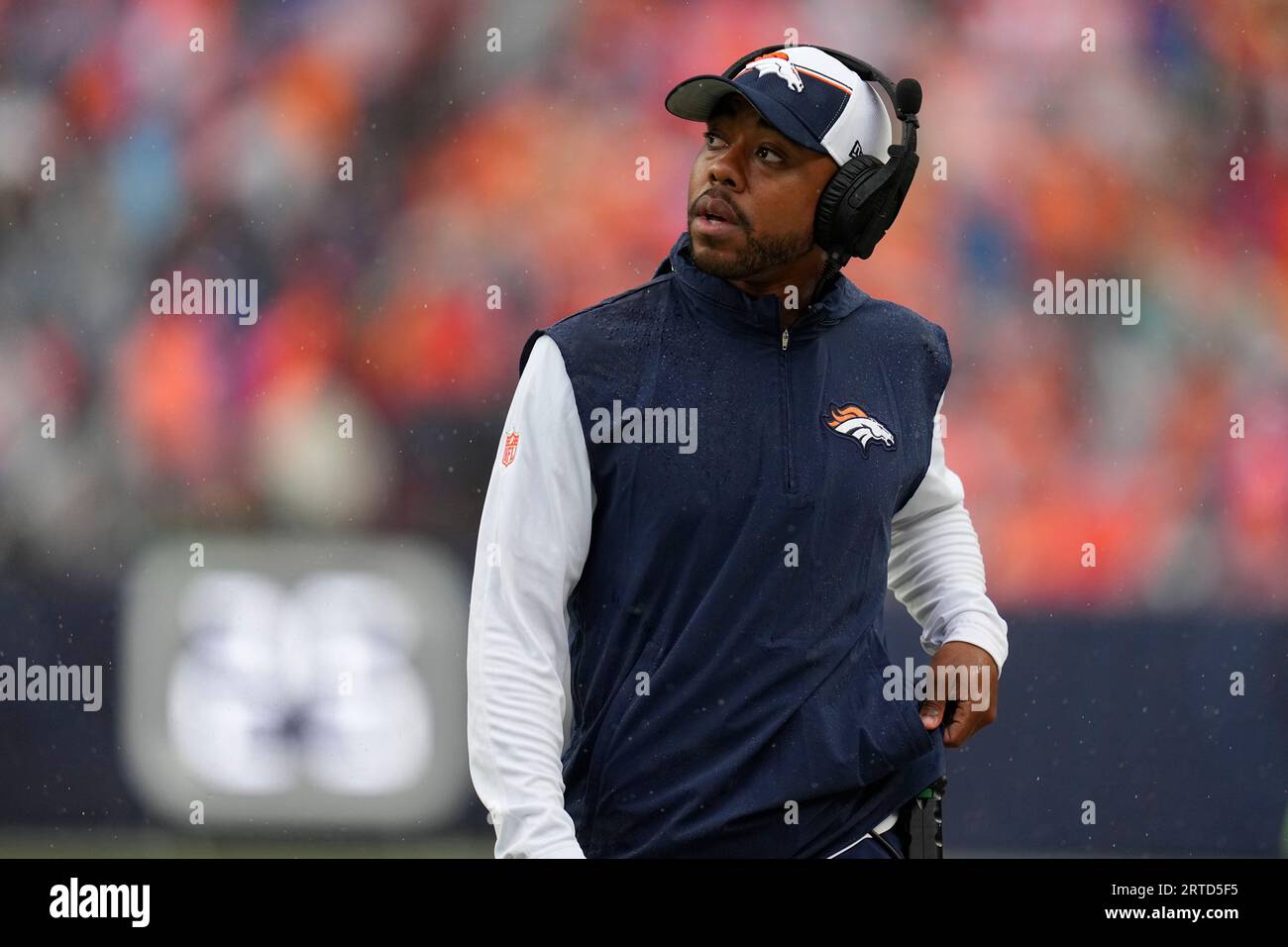 Denver Broncos defensive back coach Christian Parker looks on against ...