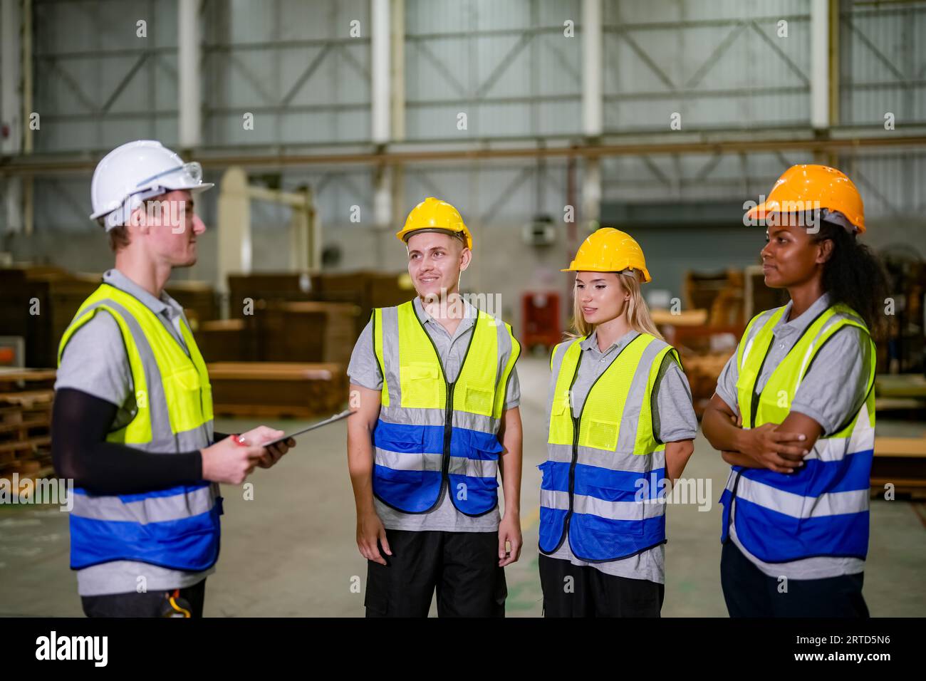 Group of smiling worker standing together at logistic distribution ...