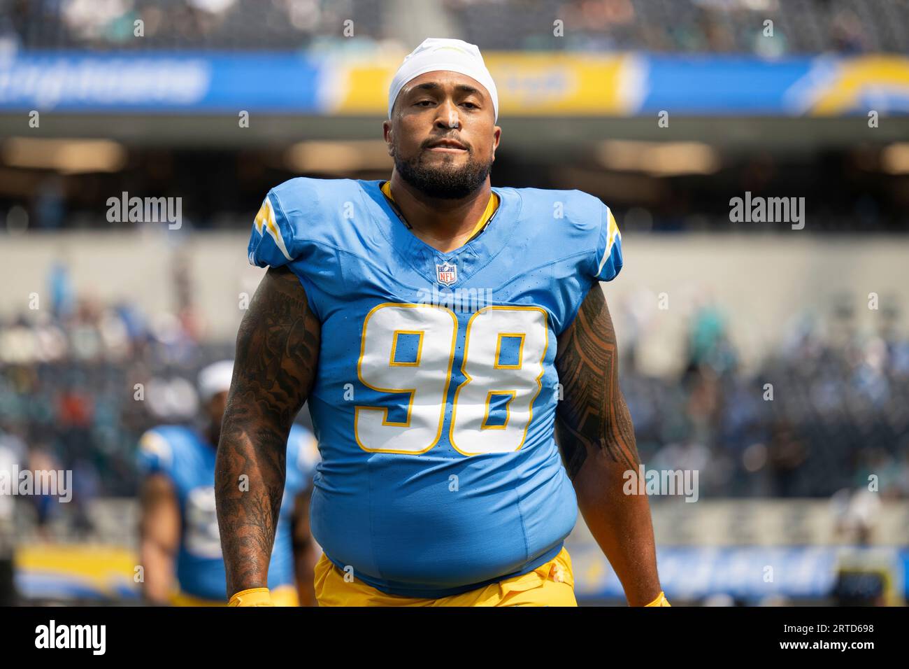 Los Angeles Chargers defensive tackle Austin Johnson (98) walks back to ...