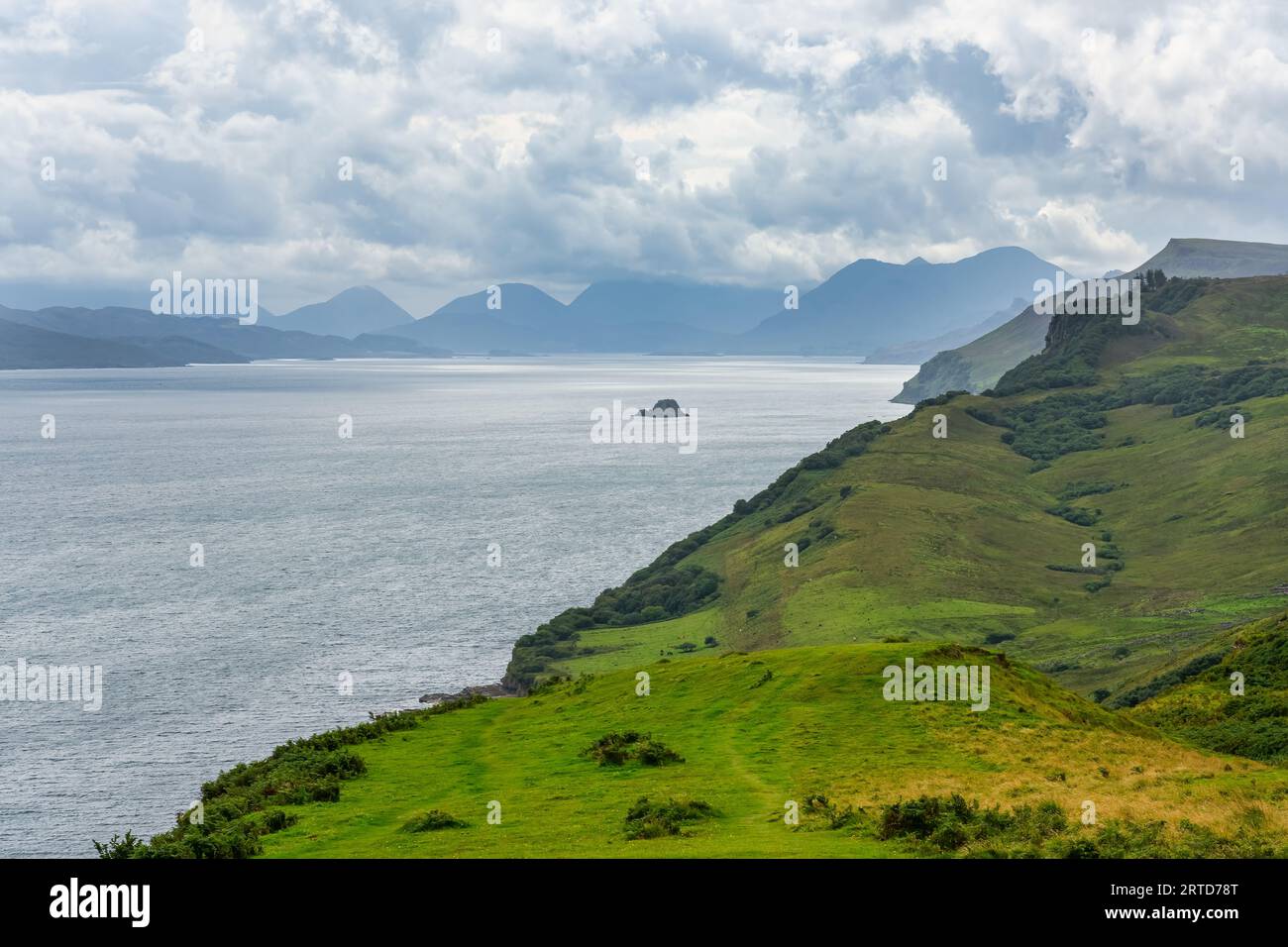 Cliffs and mountains by the sea on the stunning Isle of Skye, Scotland ...
