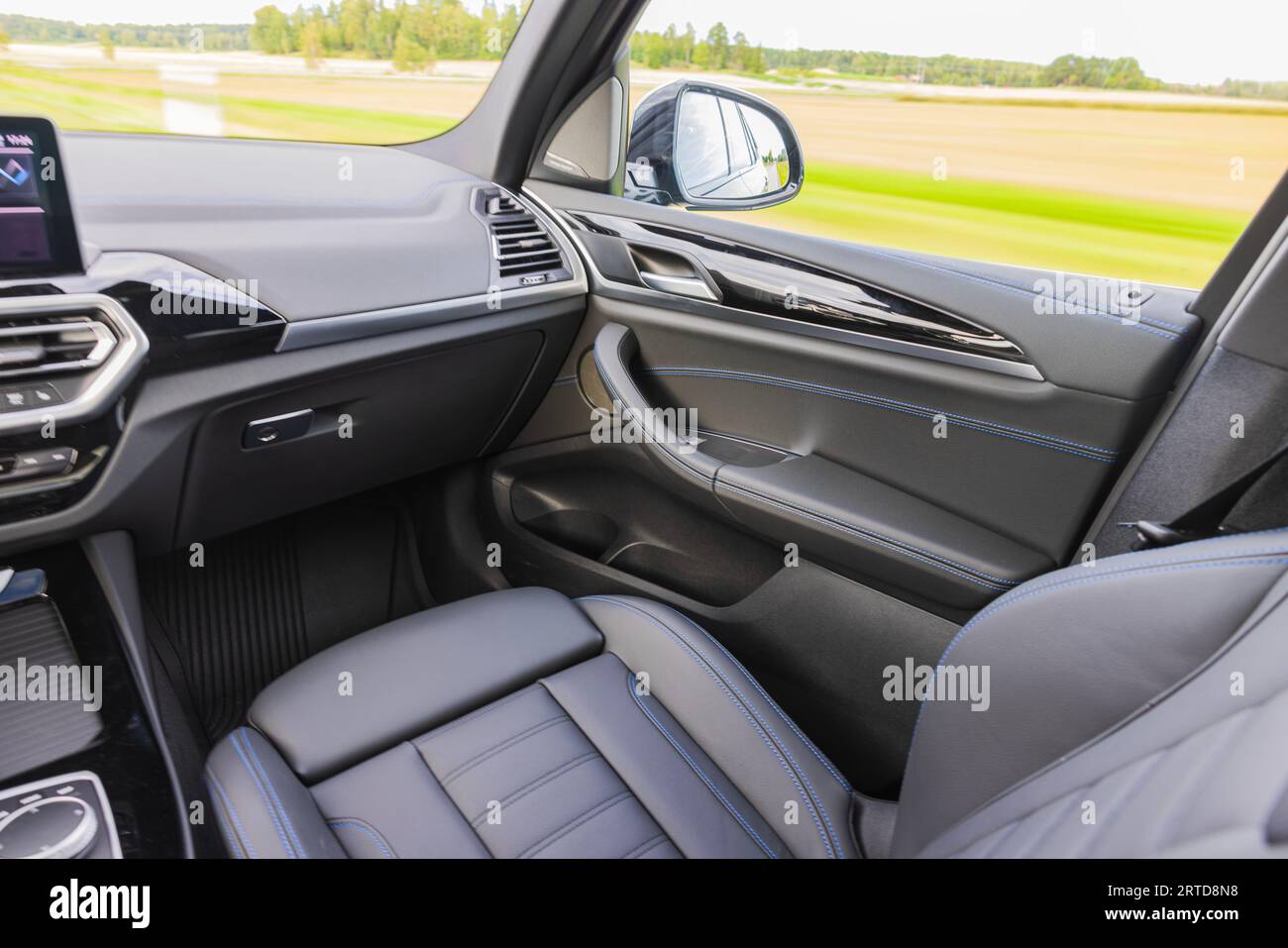 Beautiful view of interior of front leather seats of car while driving ...
