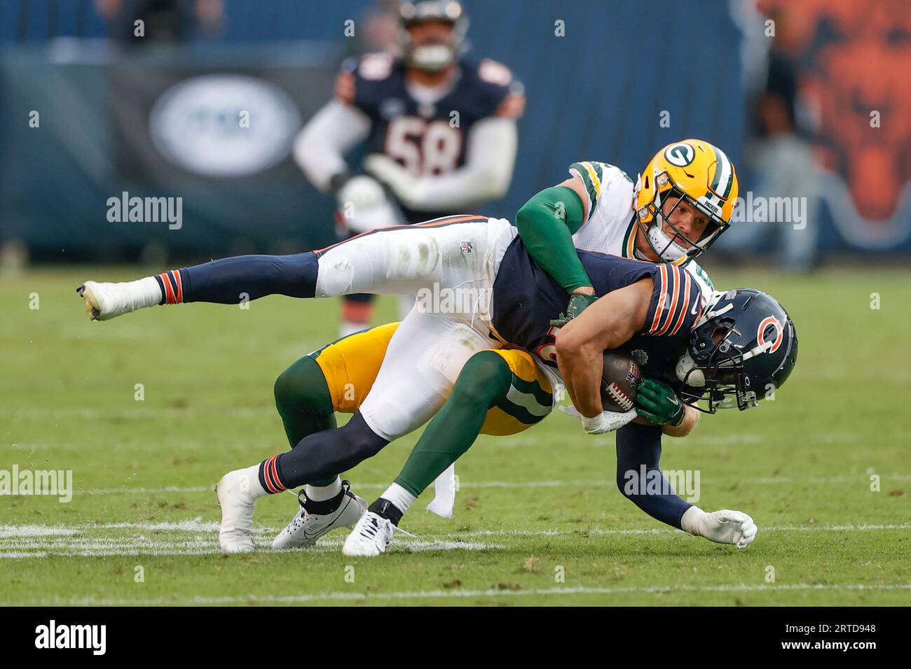 Chicago Bears wide receiver Tyler Scott (13) is tackled by Green Bay ...