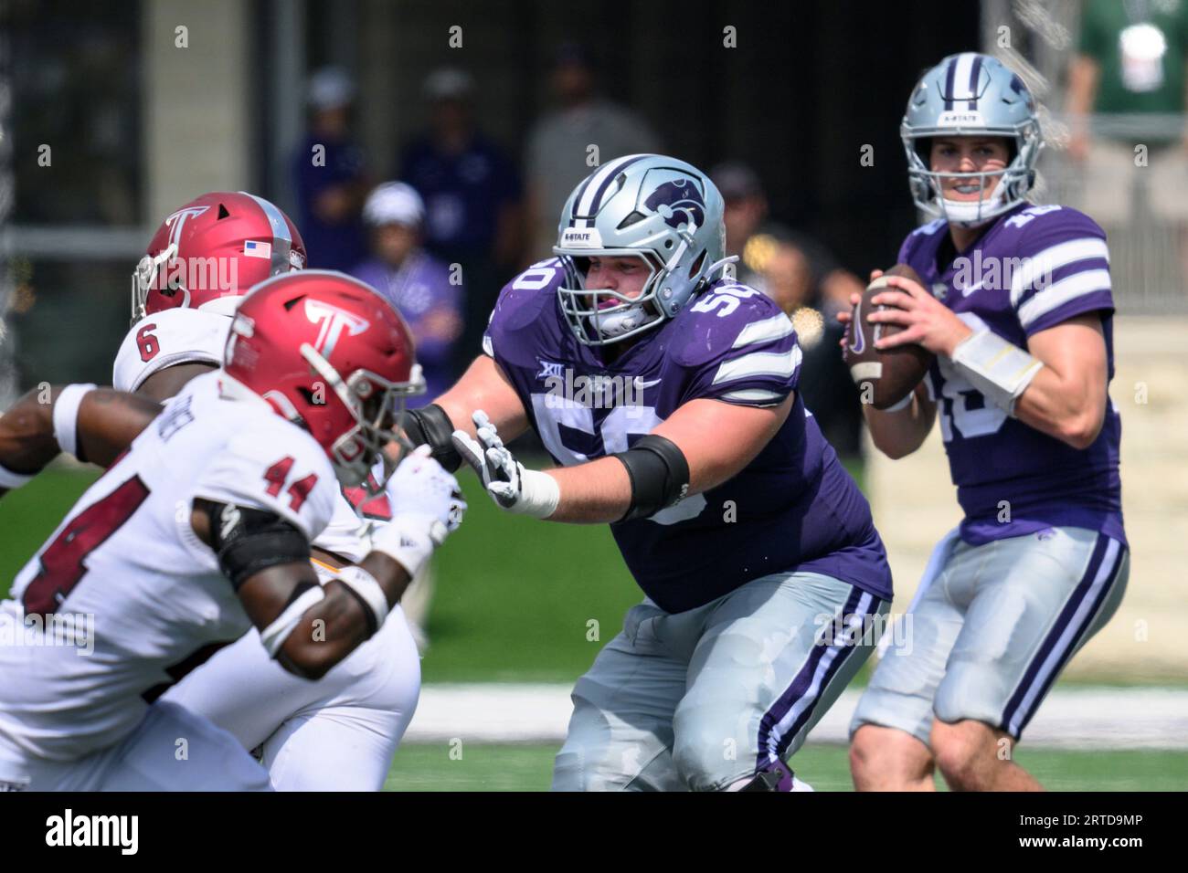 Kansas State offensive lineman Cooper Beebe (50) blocks for Kansas State quarterback Will Howard ...