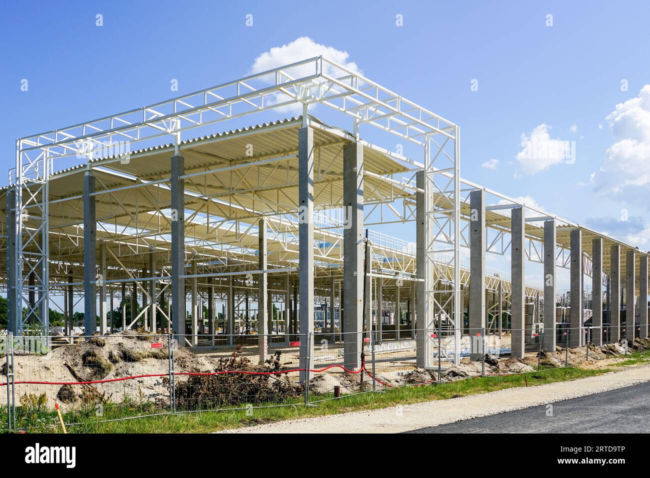 Unfinished warehouse steel frame structure on reinforced concrete ...