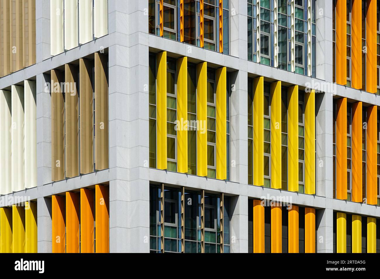 Office building facade fragment with colorful vertical window shutter ...