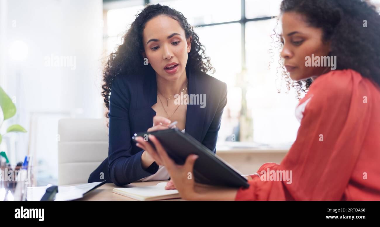 Teamwork, tablet and business women coaching in office helping coworker ...