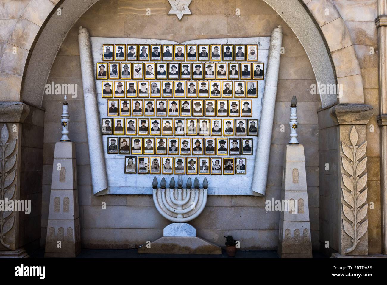 Memorial wall at the synagogue in Tbilisi with portraits of men. The ...