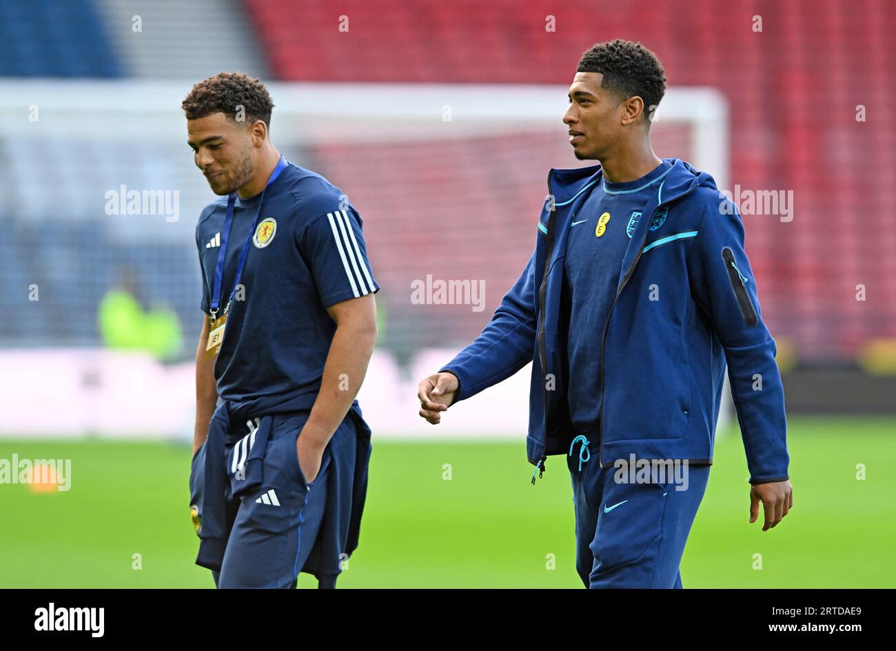 Glasgow, UK. 12th Sep, 2023. Che Adams of Scotland and Jude Bellingham ...
