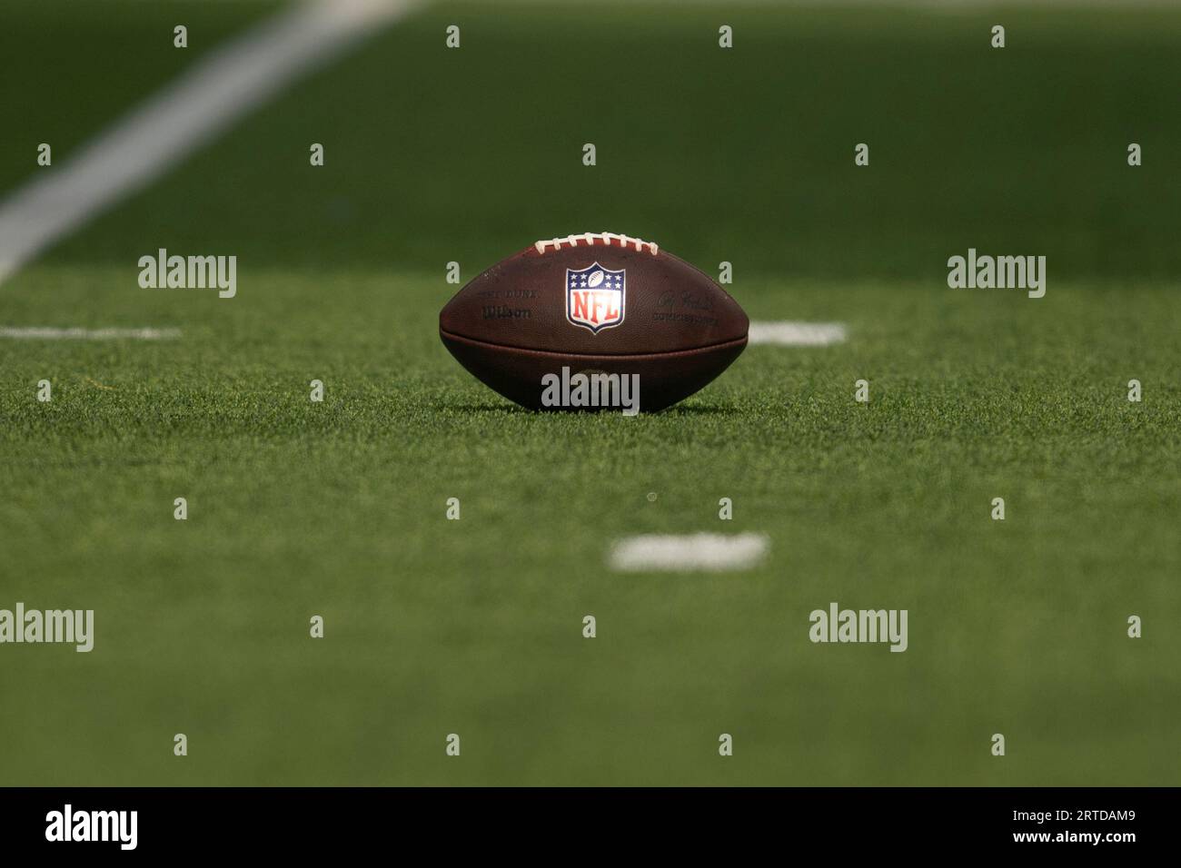 An National Football League ball sits on the field during an NFL ...