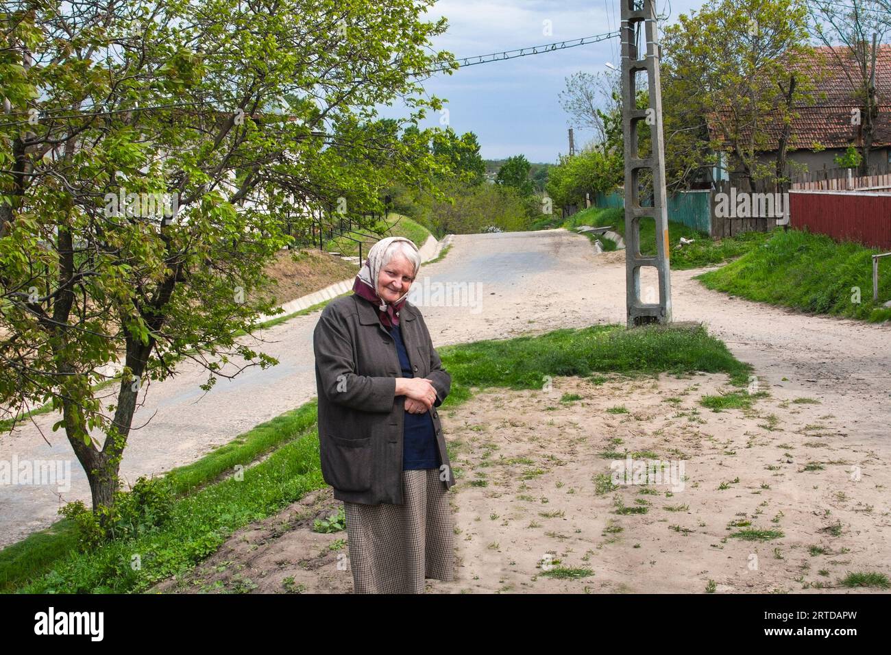 old woman with a scarf and white hair typical granny in eastern europe ...