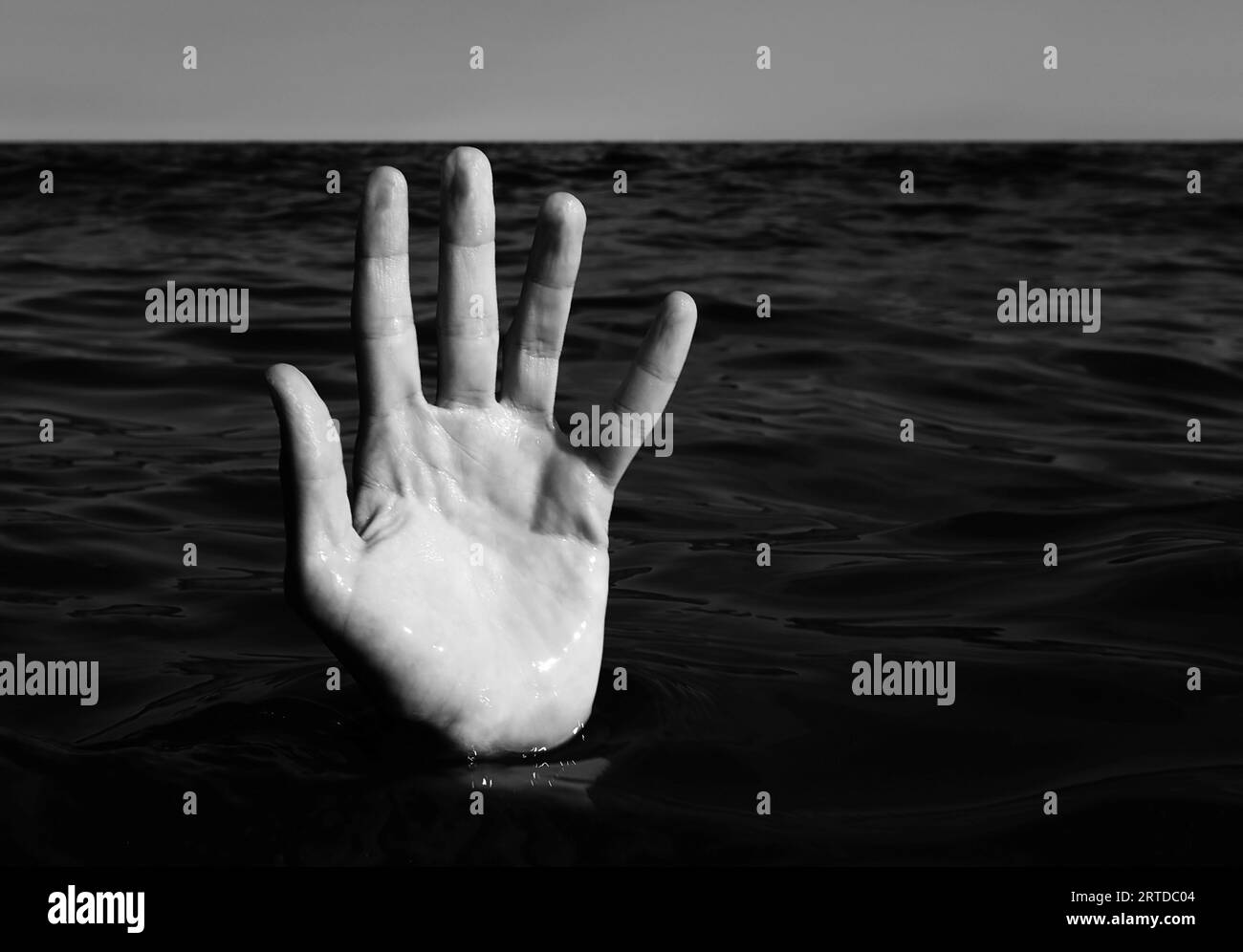 five fingers of the hand of the person who is drowning in the ocean and ...