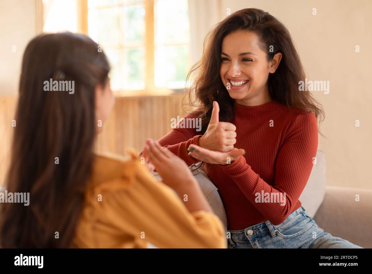 Mother and daughter using sign language hi-res stock photography and ...