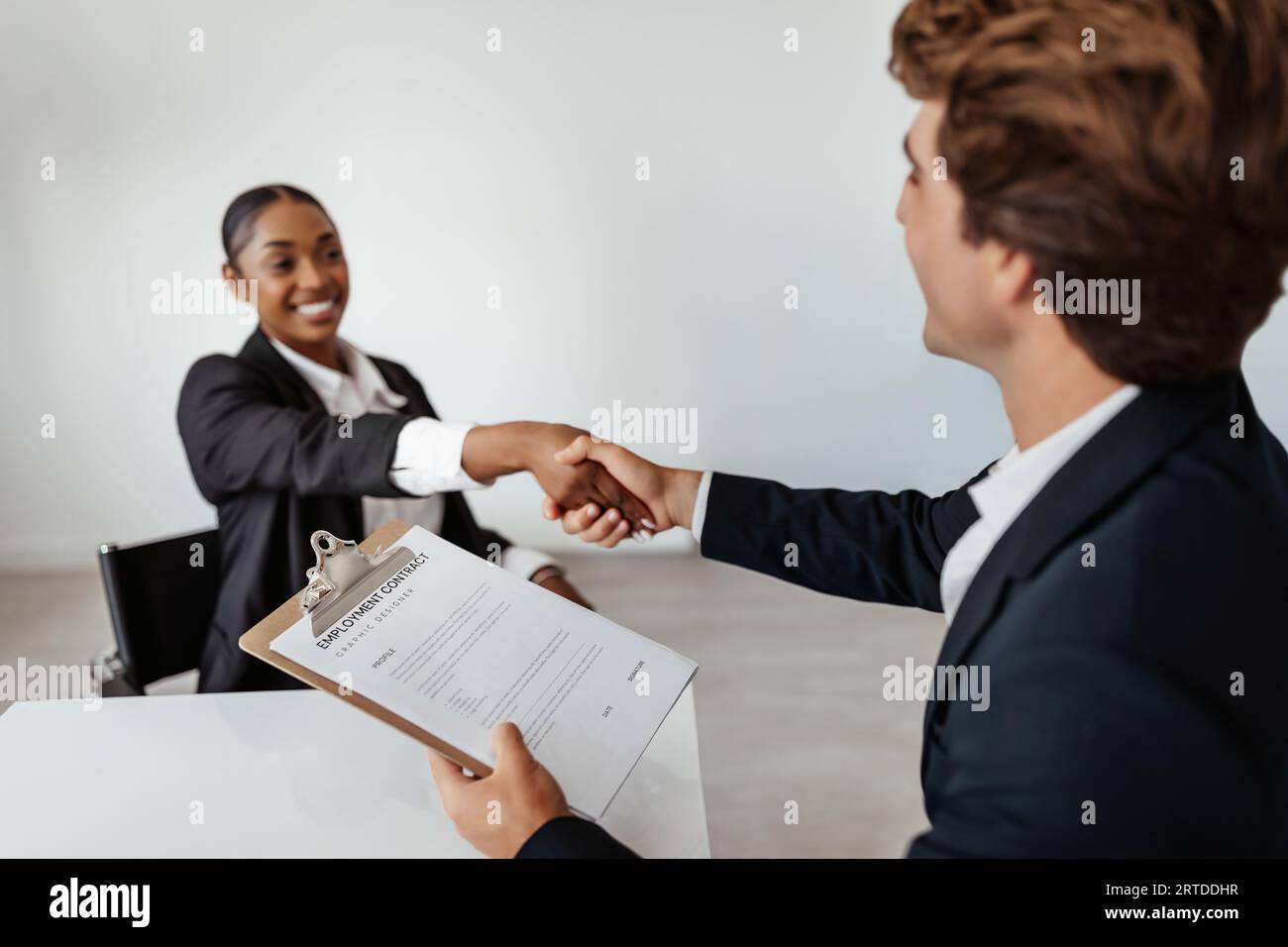 Happy personnel manager and black female job applicant shaking hands ...