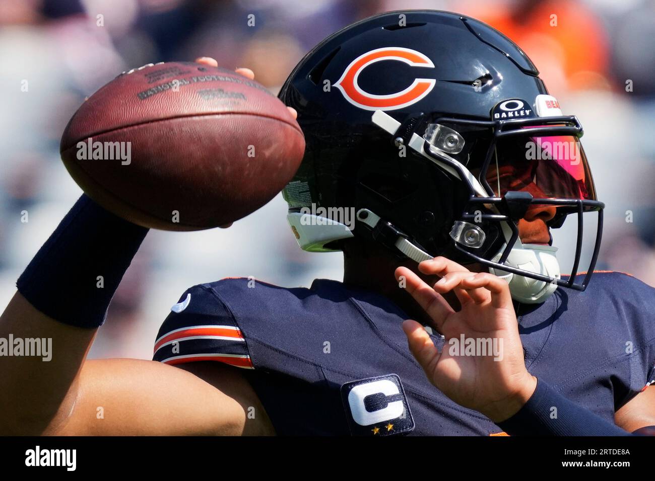 Chicago Bears quarterback Justin Fields warms up on the field before an ...