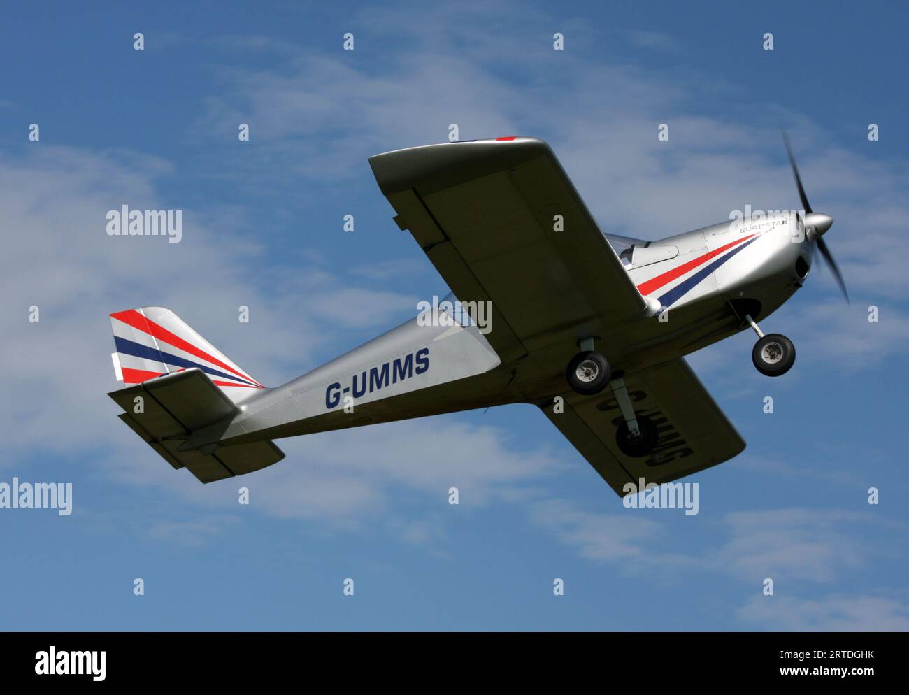An Evektor EV-97 Eurostar ultralight aircraft departs an airfield in ...