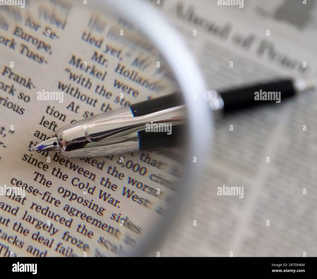 Close Up View On International Newspapers With A Magnifying Glass And A ...