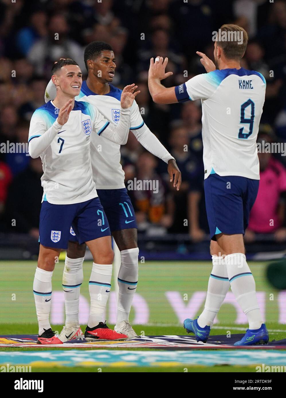 England’s Phil Foden (left) celebrates scoring the opening goal with ...
