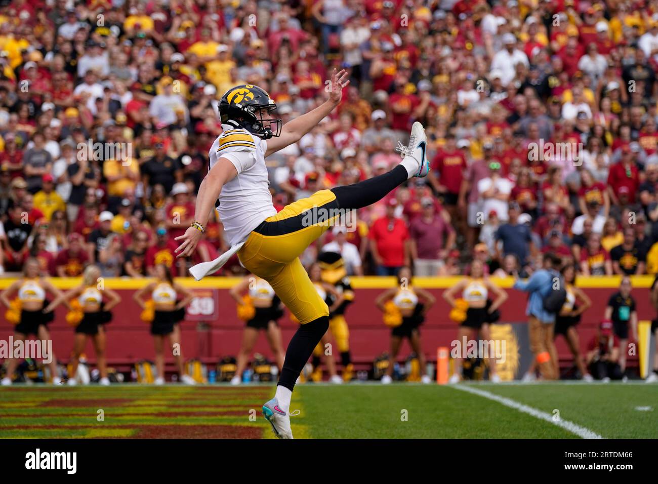 Iowa punter Tory Taylor (9) punts during the first half of an NCAA ...