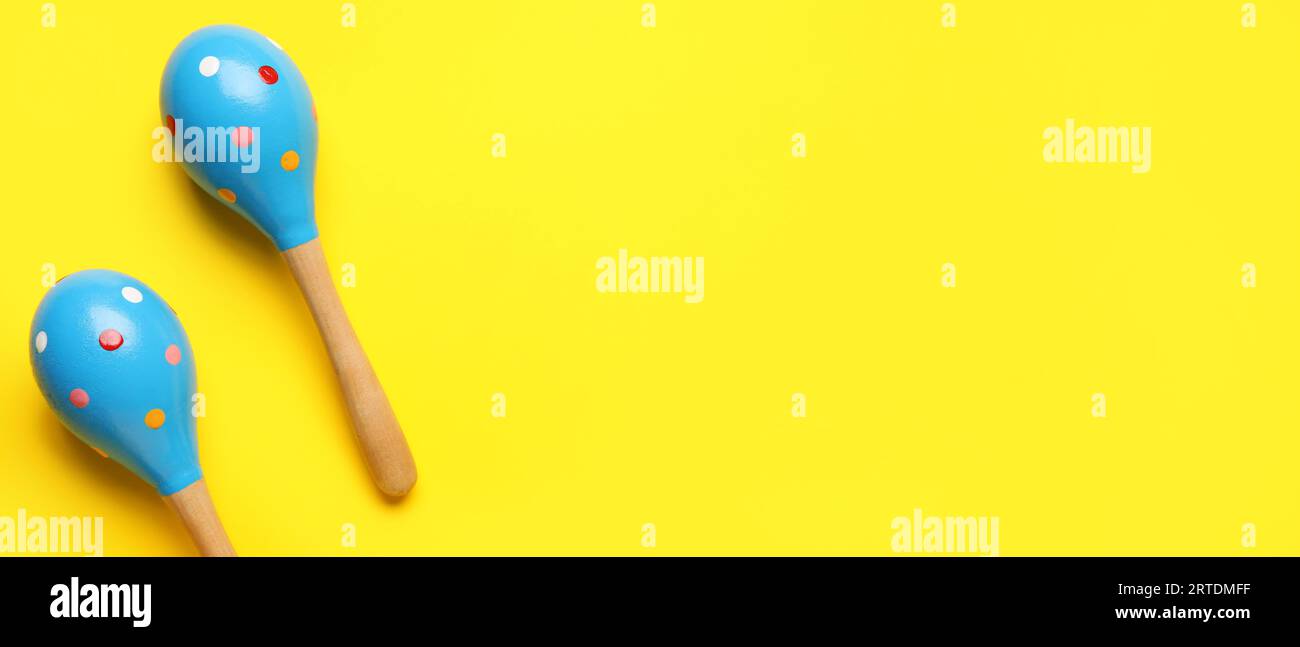 Mexican maracas on yellow background with space for text Stock Photo ...