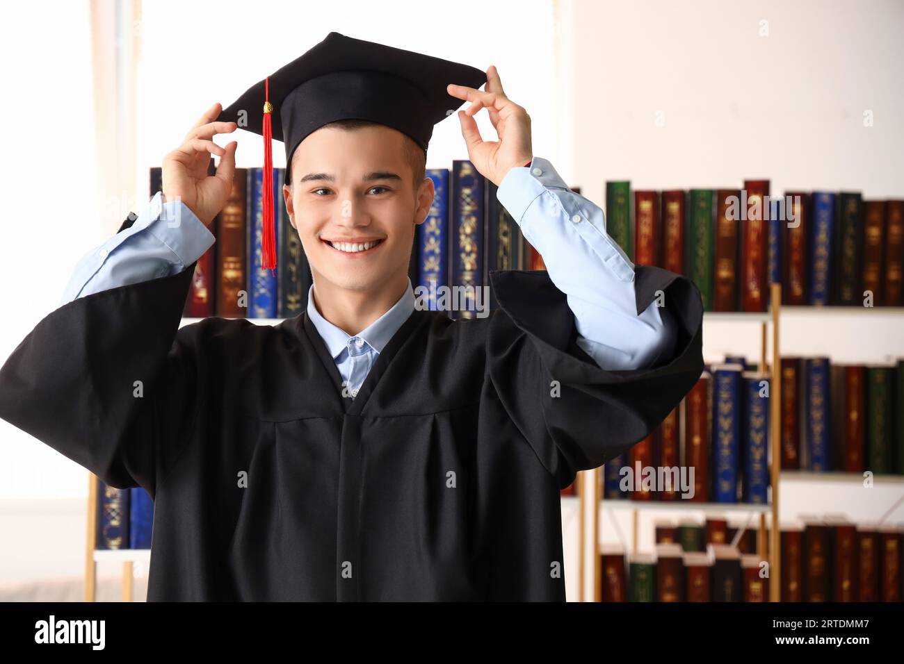 Male graduate student at university Stock Photo - Alamy