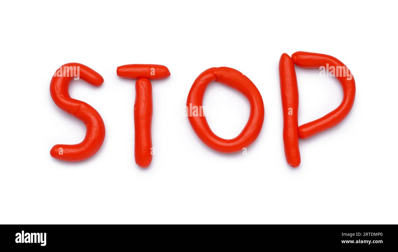 Red word STOP made of play dough on white background Stock Photo - Alamy