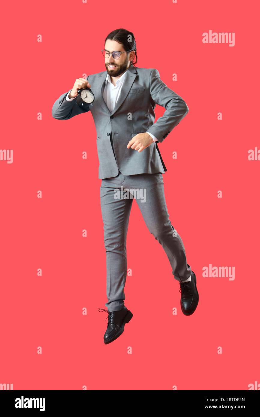 Jumping businessman alarm clock hi-res stock photography and images - Alamy