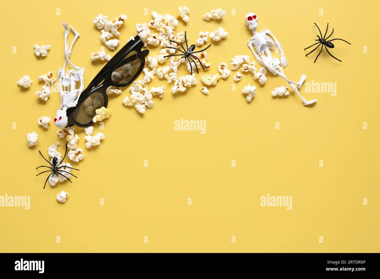 Composition with tasty popcorn, 3D glasses, spiders and skeletons for ...