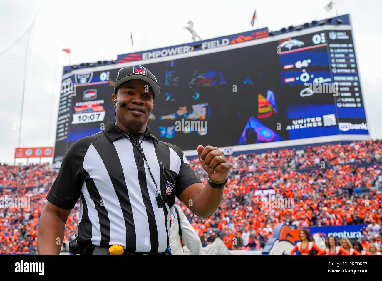 Umpire Alex Moore (49) takes the field during an NFL football game ...