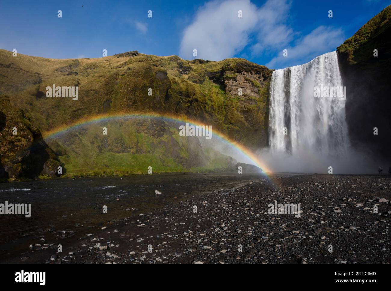 Iceland. A rainbow over the Skogafoss waterfall in Skogar, South ...