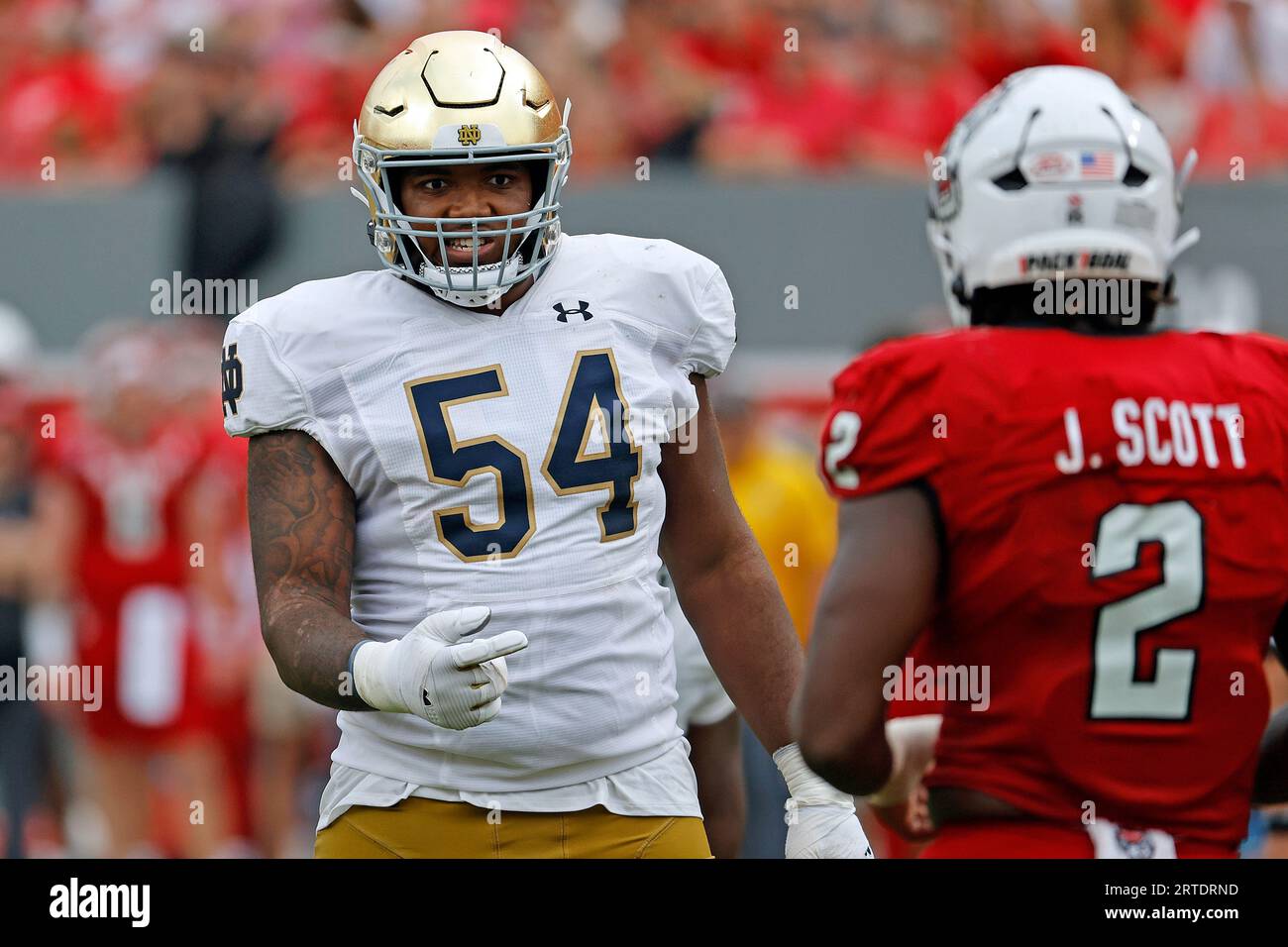 Notre Dame offensive lineman Blake Fisher (54) calls for the blocking ...