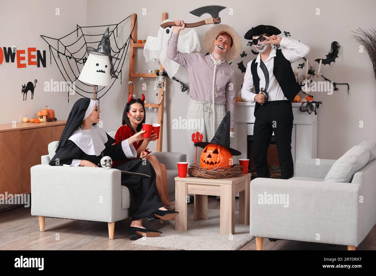 Women in halloween costumes drinking hi-res stock photography and ...