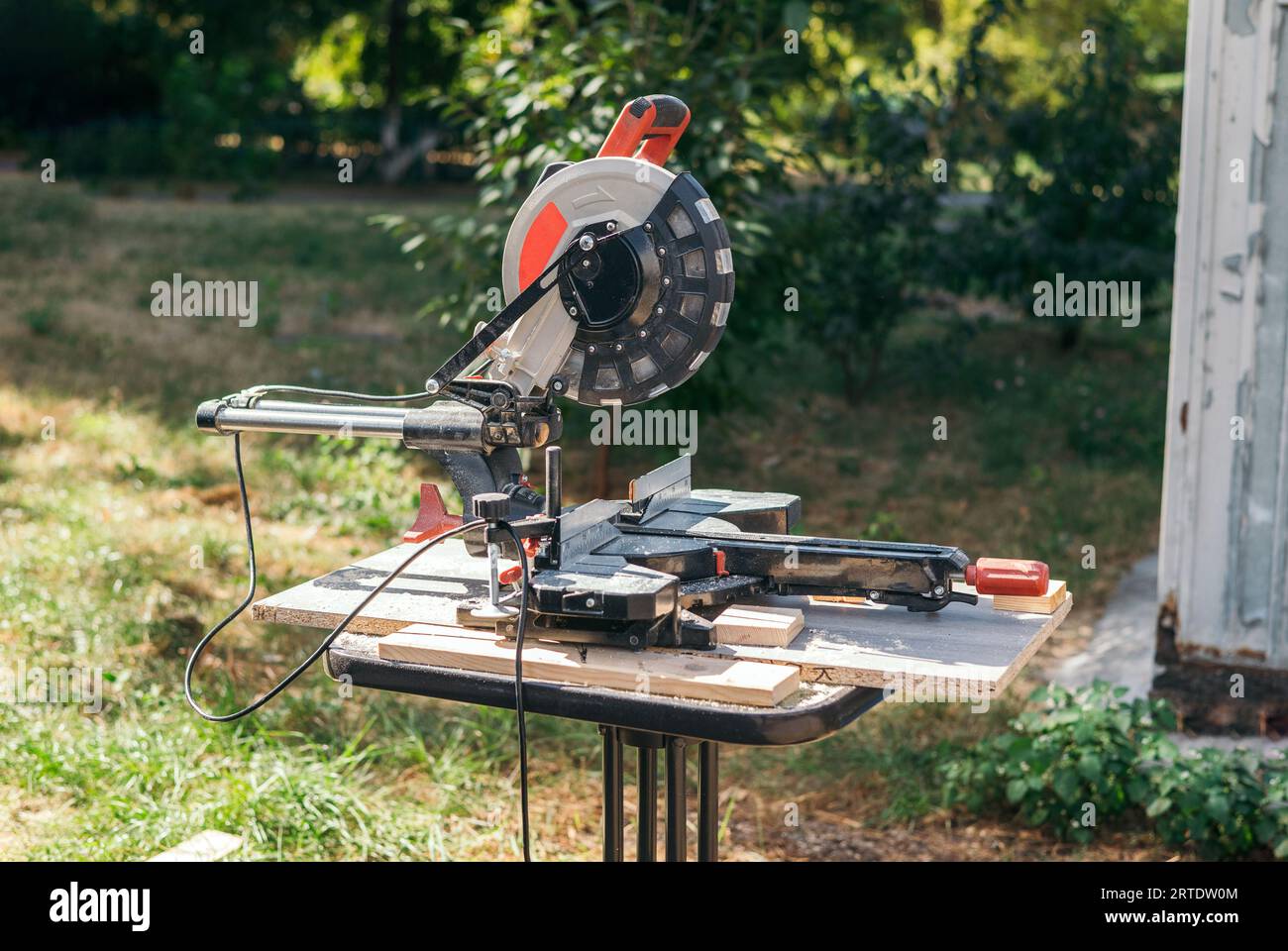 A portable workbench with a circular saw is installed in the yard Stock ...