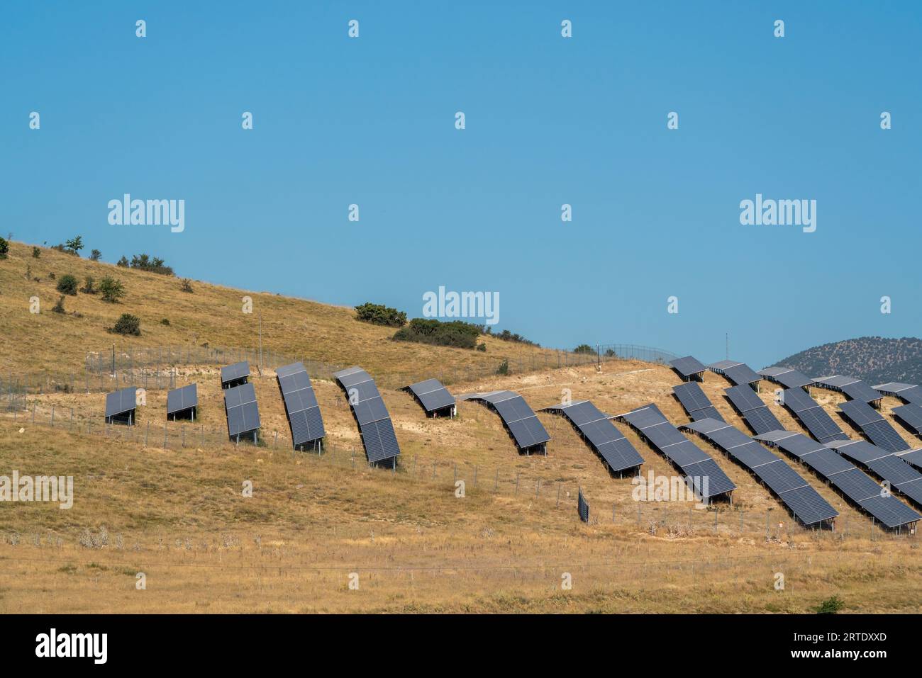 Solar energy panels installed in the fields Stock Photo - Alamy