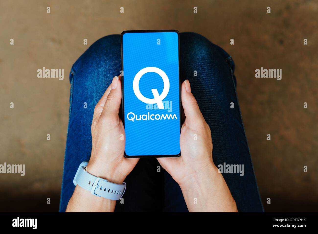 In this photo illustration, the Qualcomm logo is displayed on a ...
