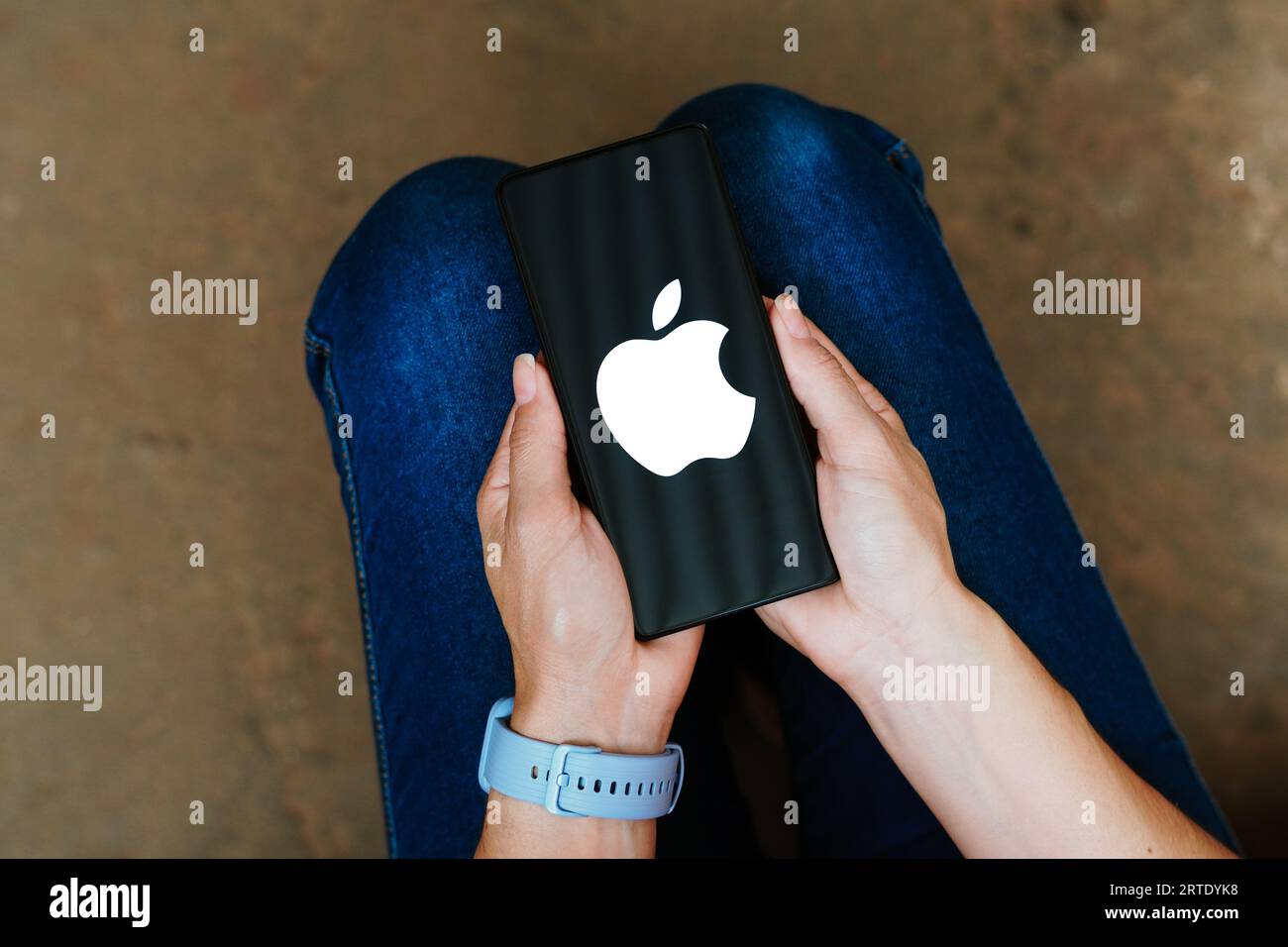 In this photo illustration, the Apple Inc. logo is displayed on a ...