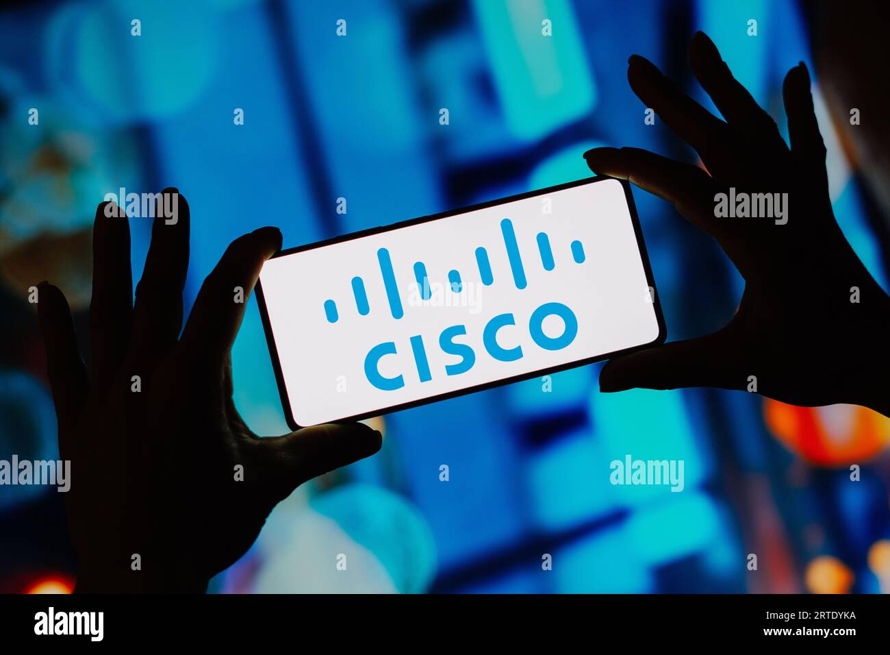 In this photo illustration, the Cisco Systems logo is displayed on a ...
