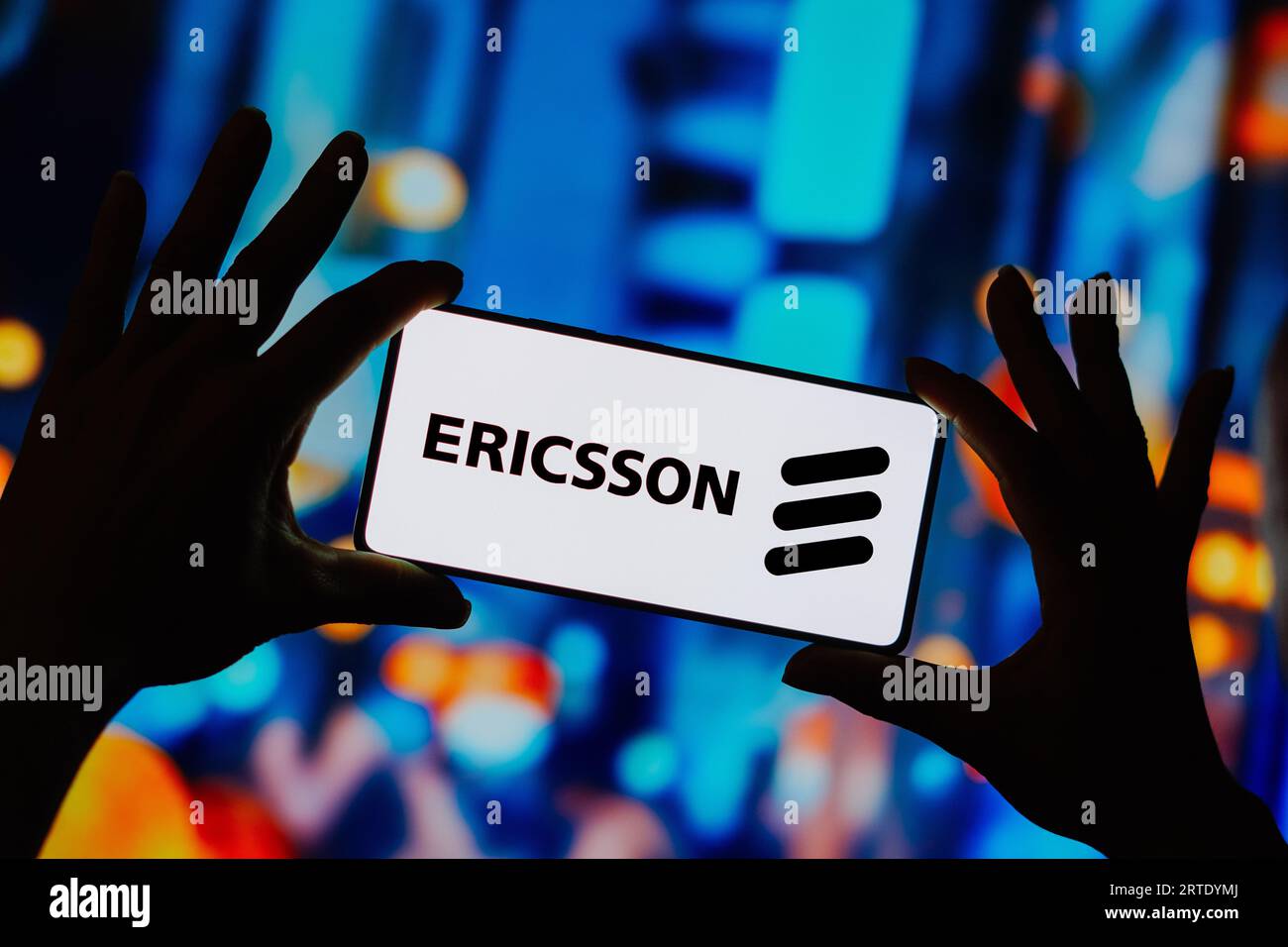 In this photo illustration, the Ericsson logo is displayed on a ...