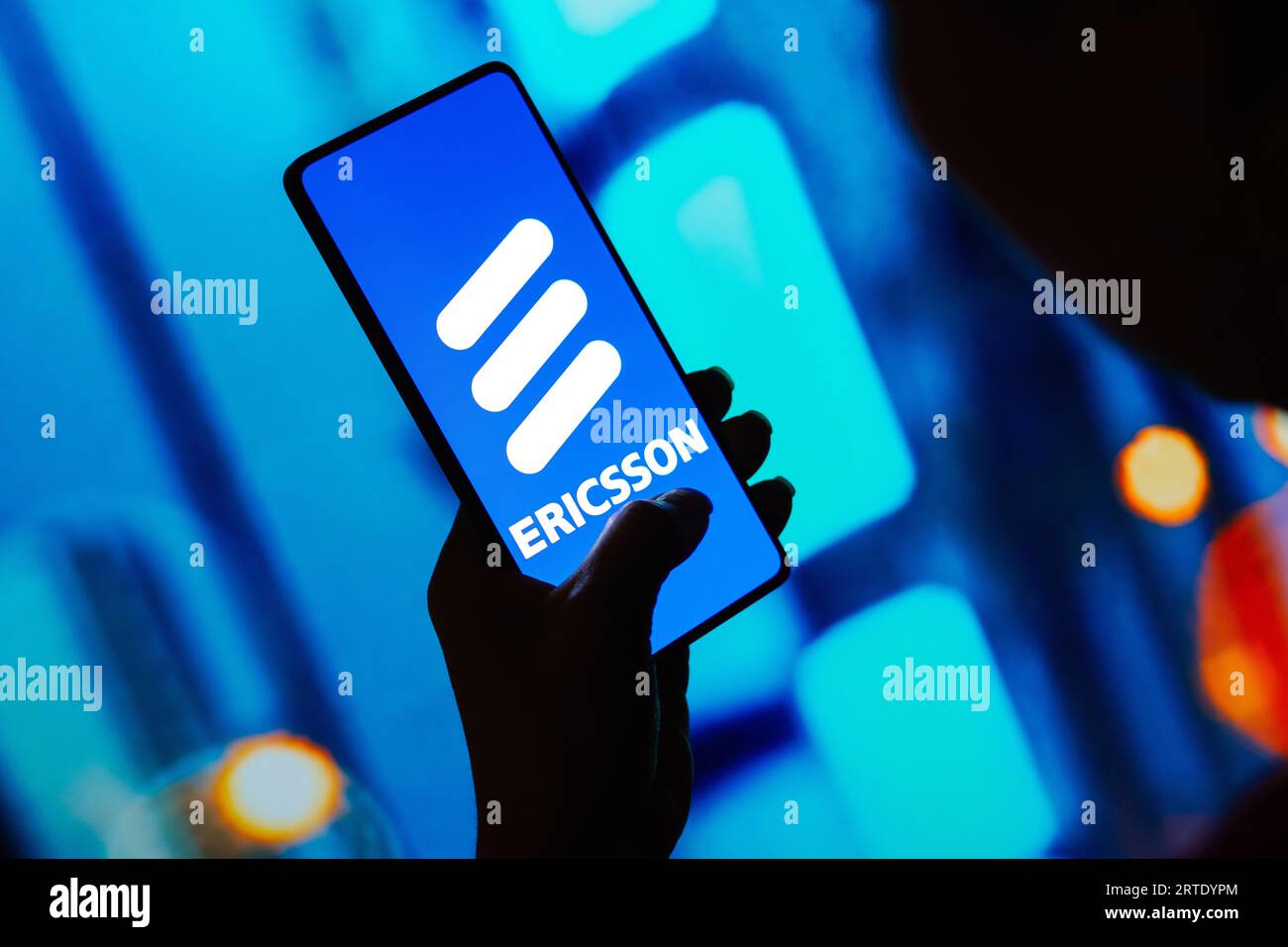 In this photo illustration, the Ericsson logo is displayed on a ...